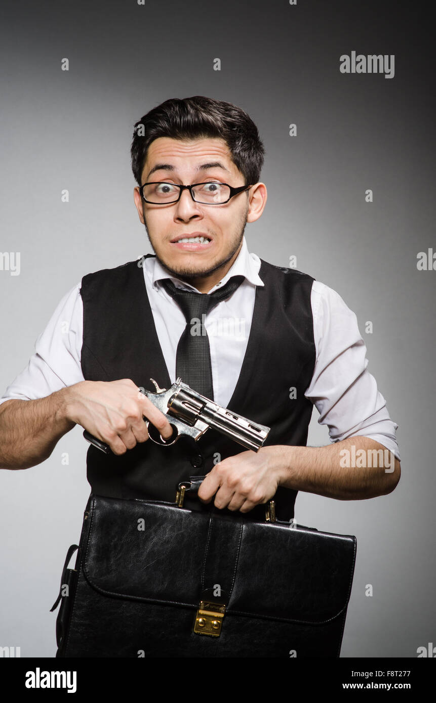 Man with gun and briefcase Stock Photo - Alamy