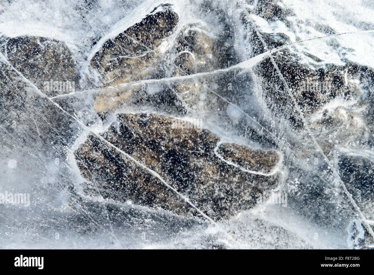 Stones under ice Stock Photo - Alamy
