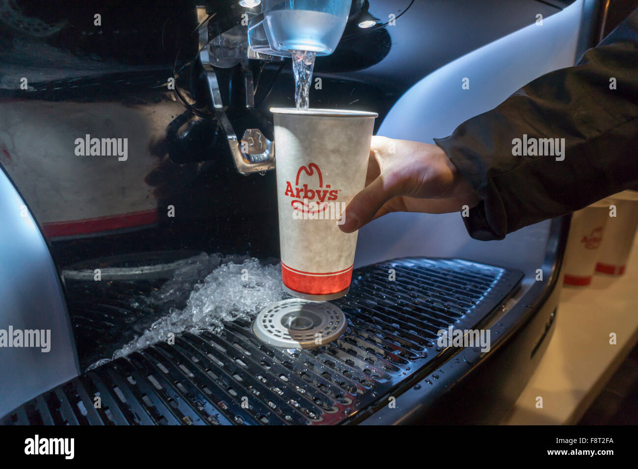 A customer fills his cup with a beverage at the new Arby's fast casual ...