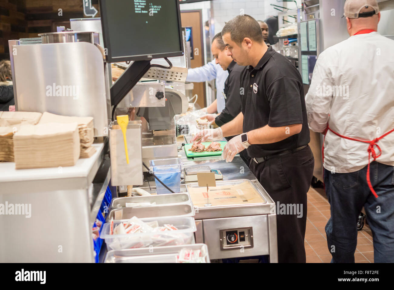 Workers in the new Arby's fast casual restaurant in Midtown in New York ...