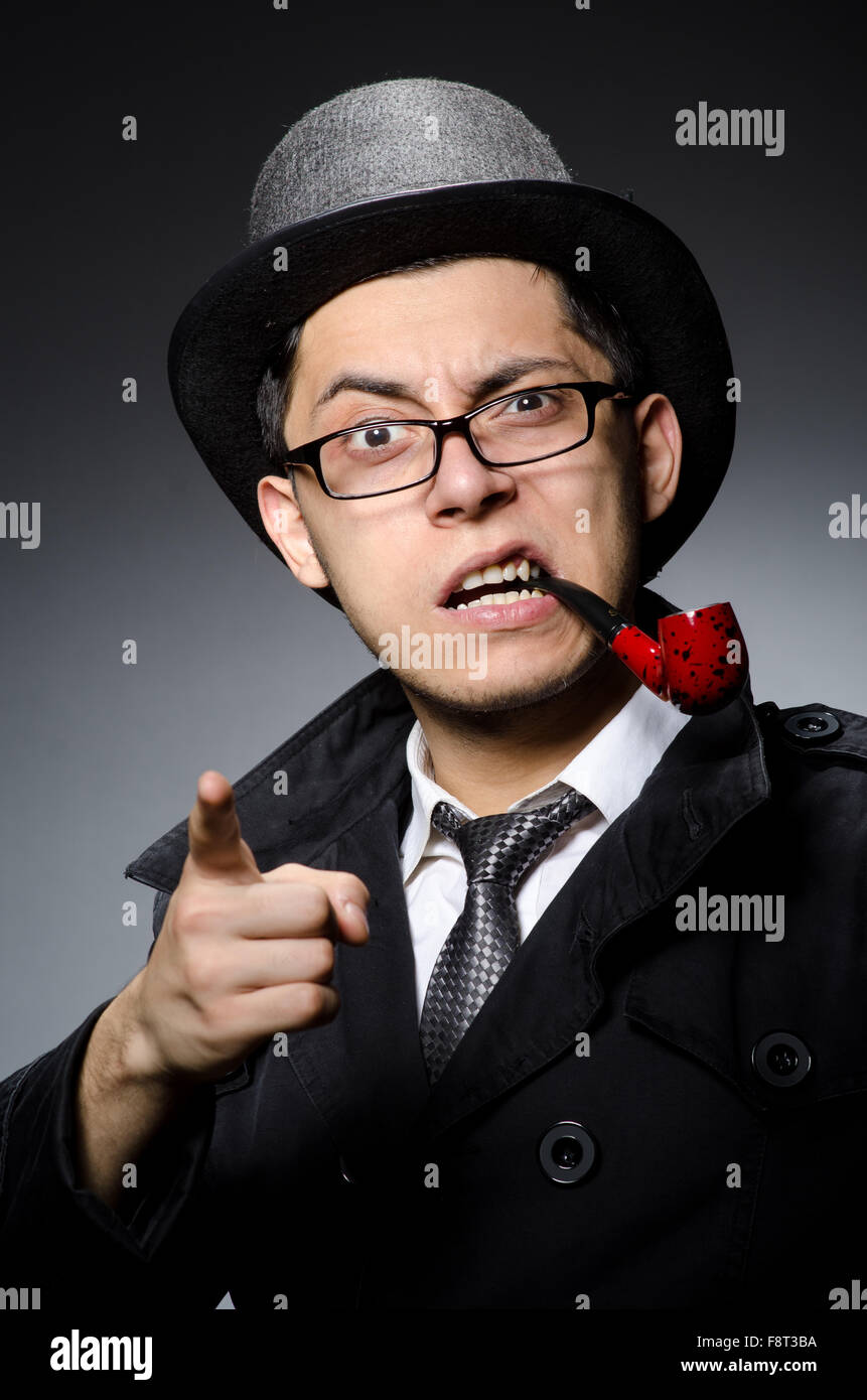 Funny detective with pipe and hat Stock Photo - Alamy