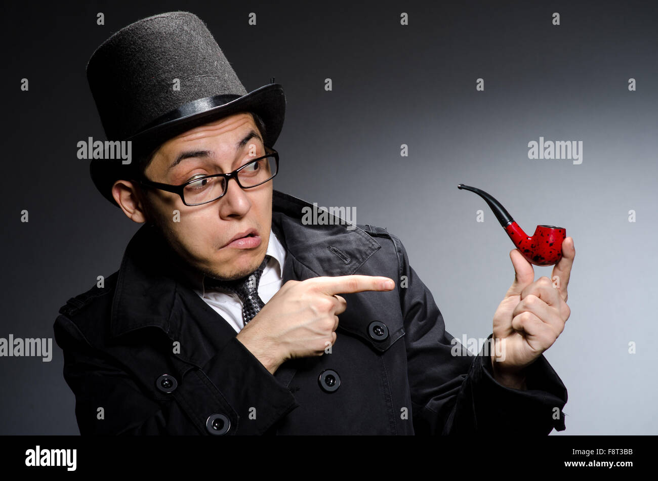 Funny detective with pipe and hat Stock Photo - Alamy