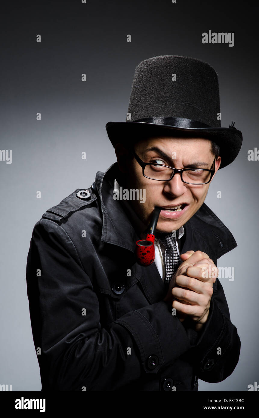 Funny detective with pipe and hat Stock Photo - Alamy