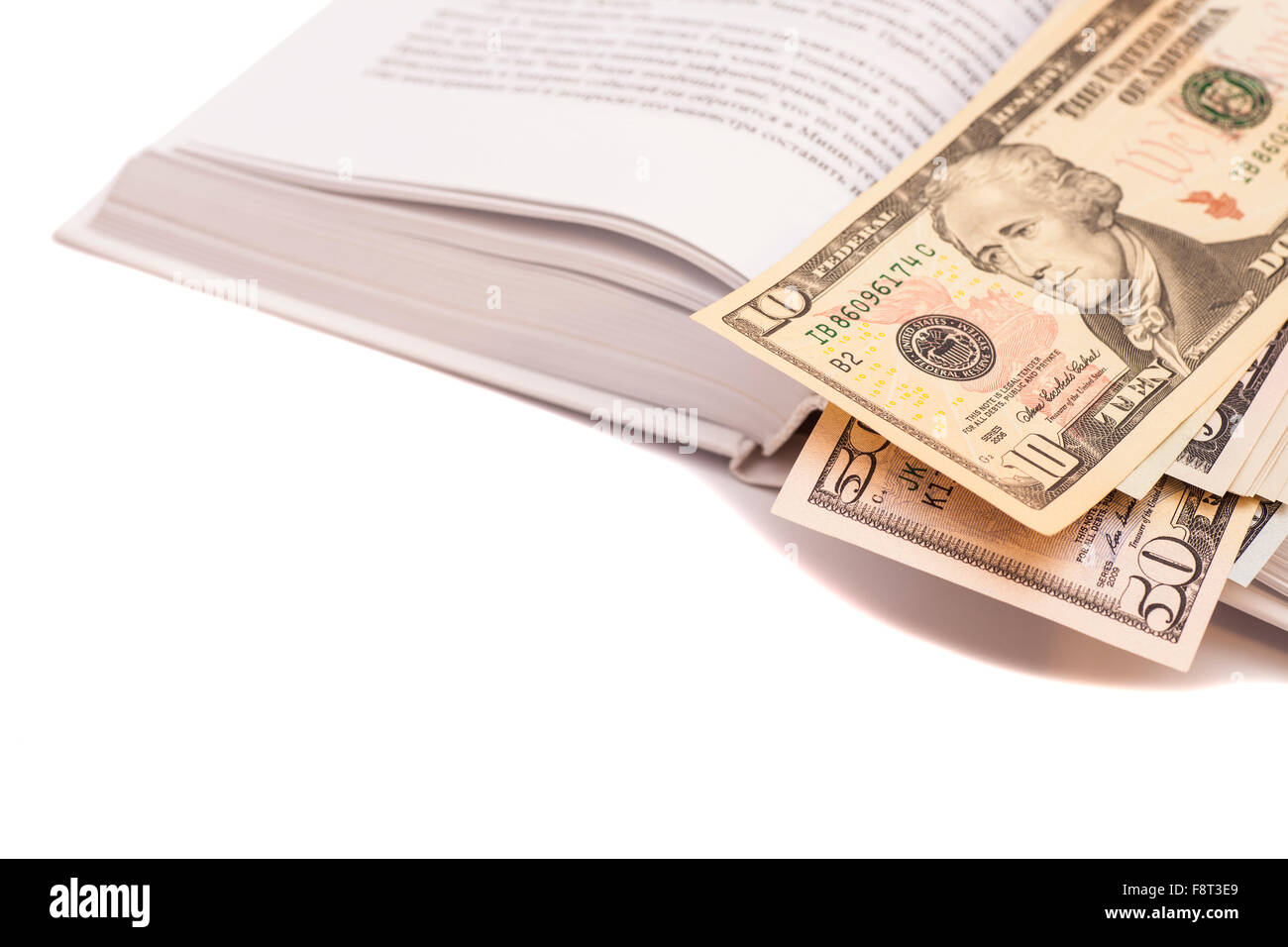 Dollars in Book Stock Photo - Alamy