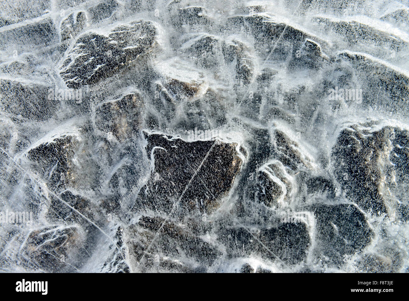 Stones under ice Stock Photo - Alamy