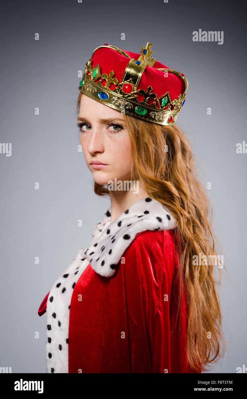 Queen in red dress in studio Stock Photo - Alamy