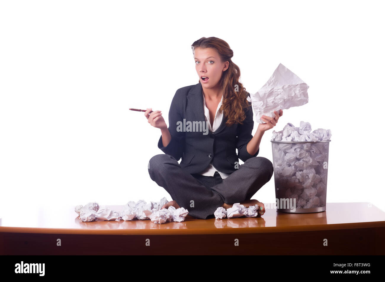 Woman with lots of discarded paper Stock Photo - Alamy