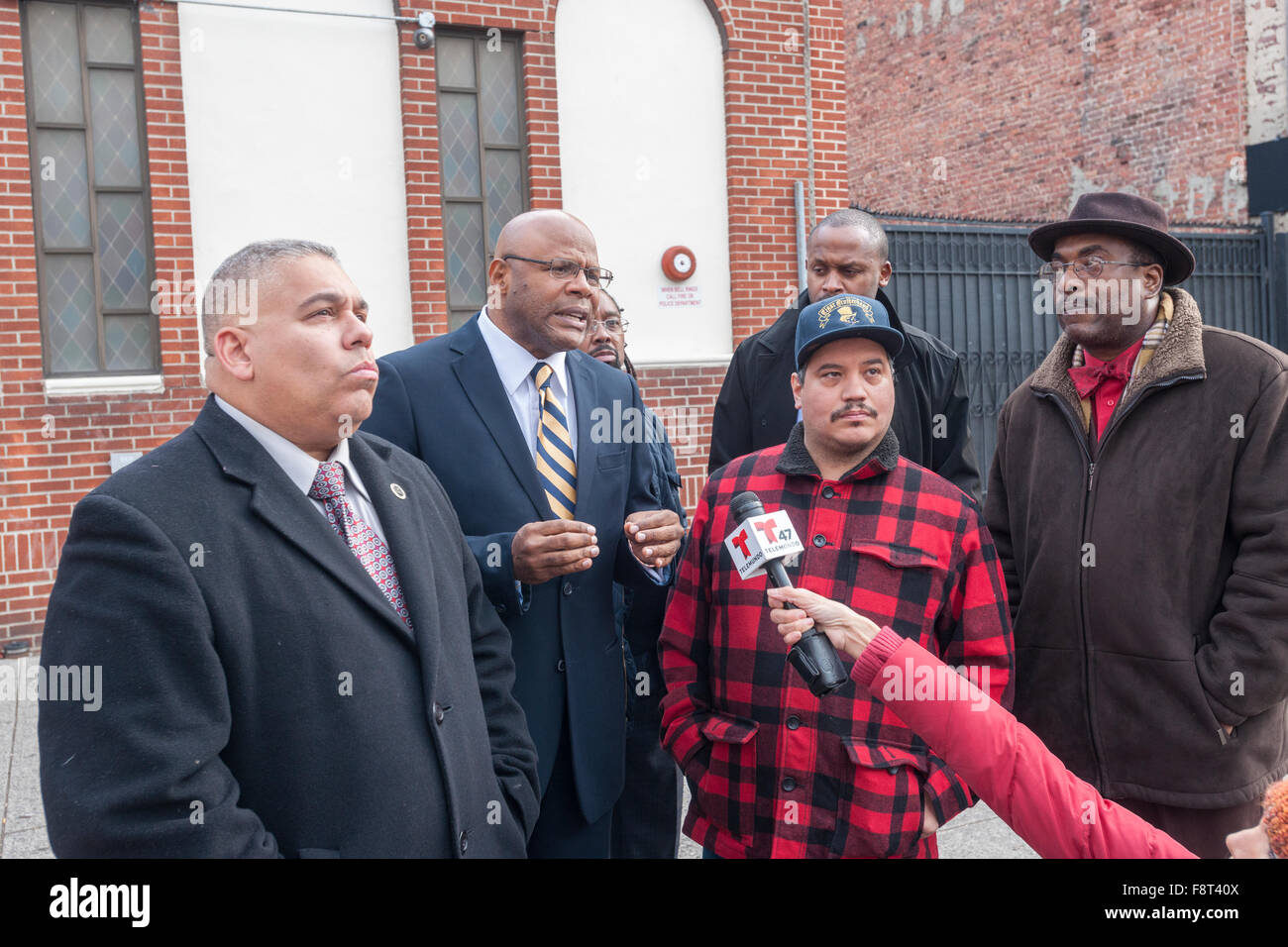 Community activist Tony Herbert, center, joined by other leaders at a ...