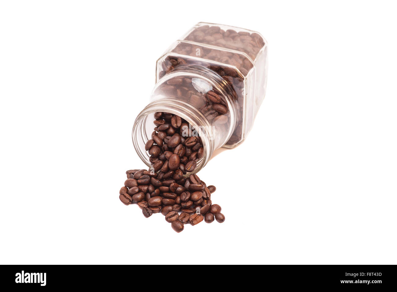 Coffee beans spilling out of a cristal jar on white background Stock ...