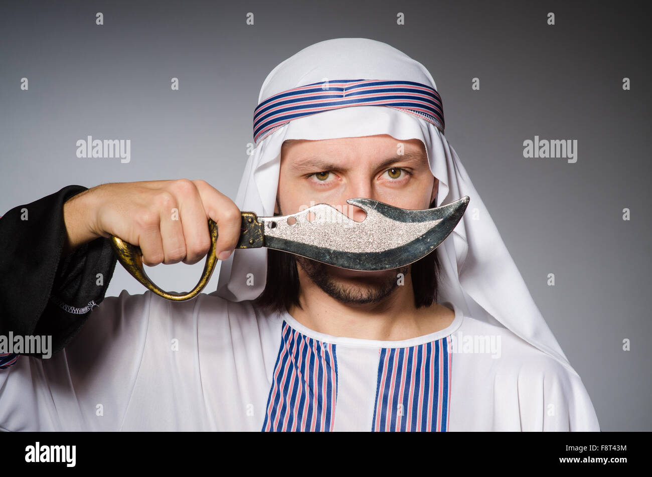 Arab man with sharp knife Stock Photo - Alamy