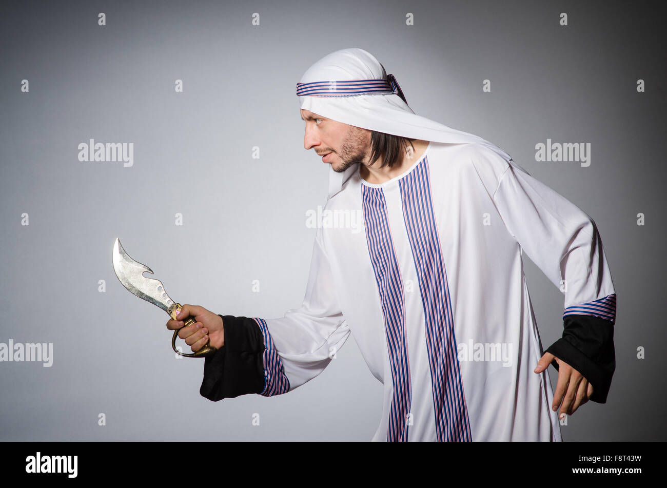 Arab man with sharp knife Stock Photo - Alamy