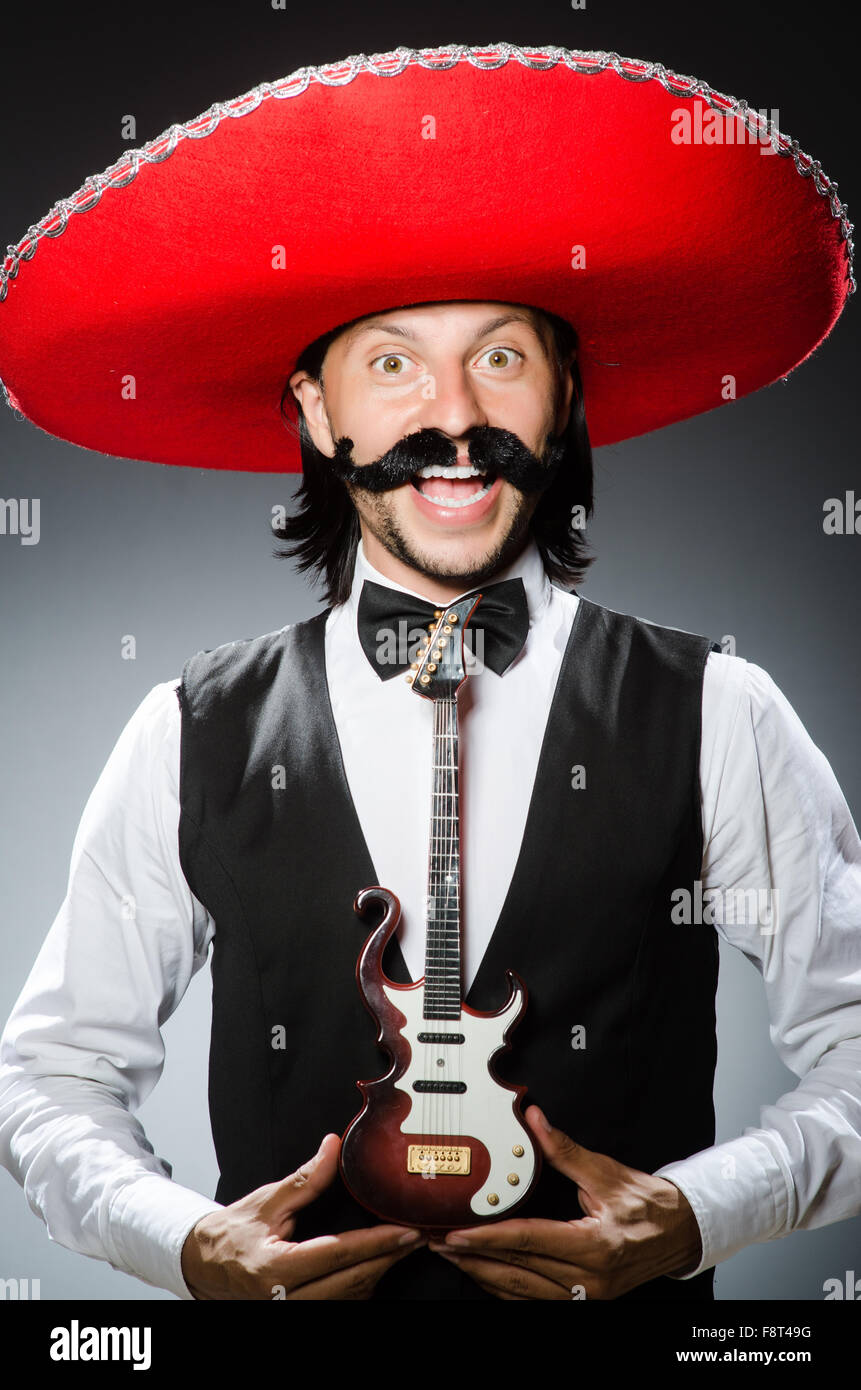 Mexican man with guitar in music concept Stock Photo - Alamy