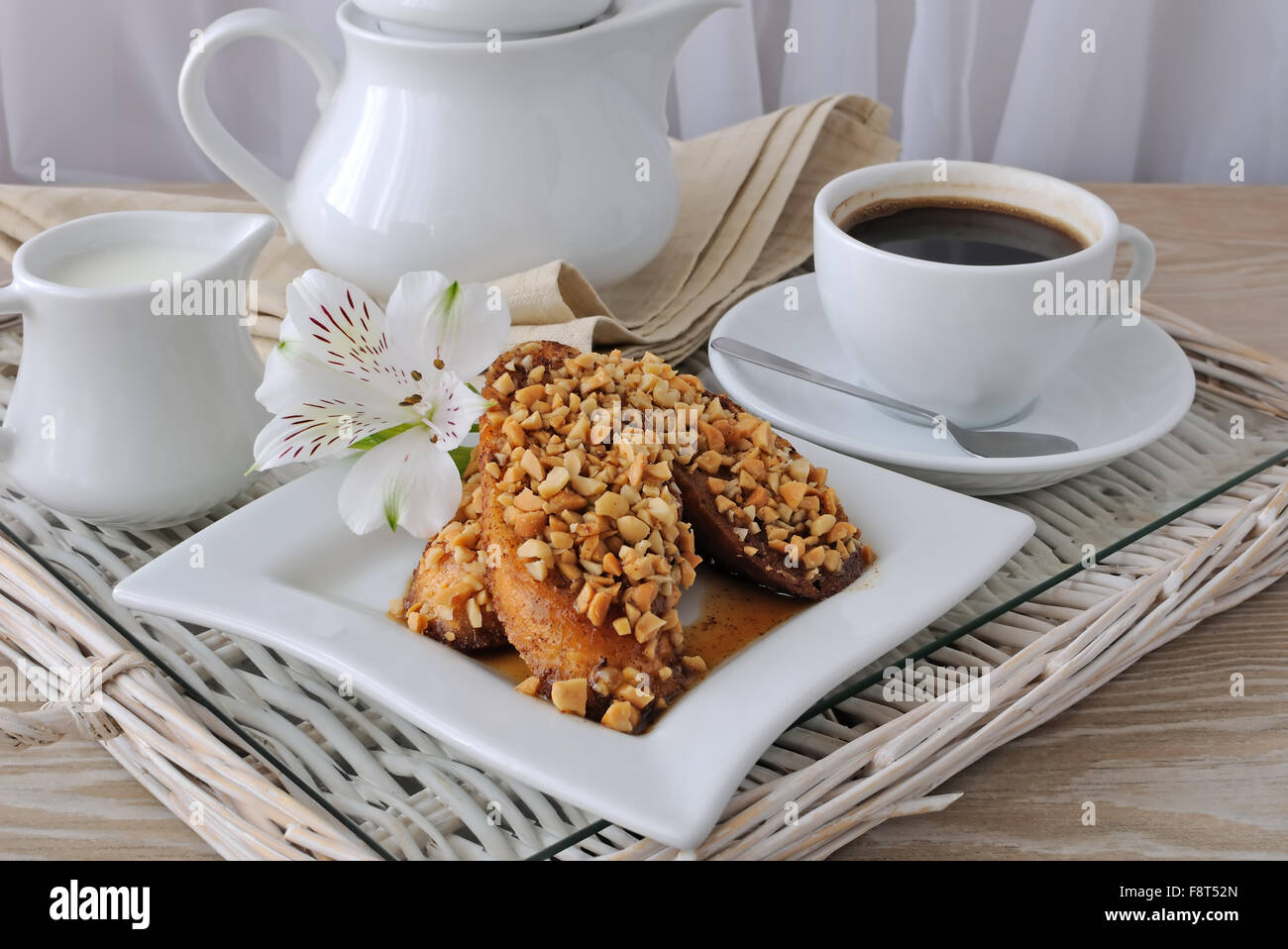 French toast with walnuts and cinnamon and a cup of coffee Stock Photo ...