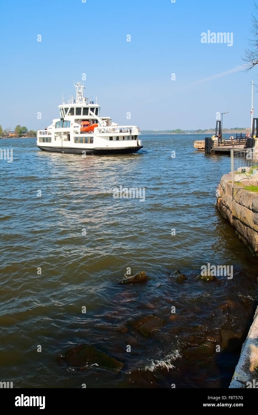 A small boat set off from the pier over the ocean waves Stock Photo - Alamy