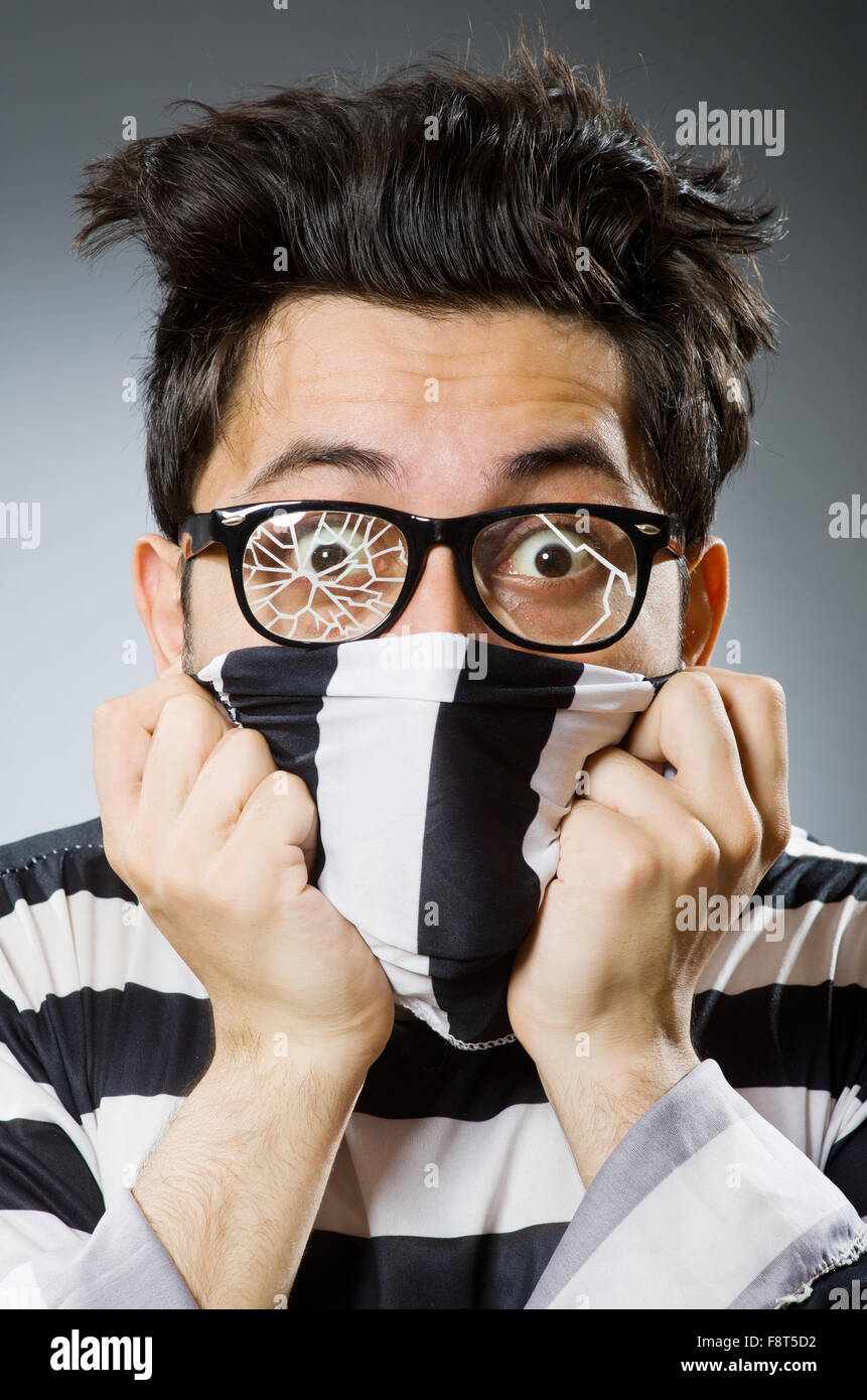 Funny prison inmate in concept Stock Photo - Alamy
