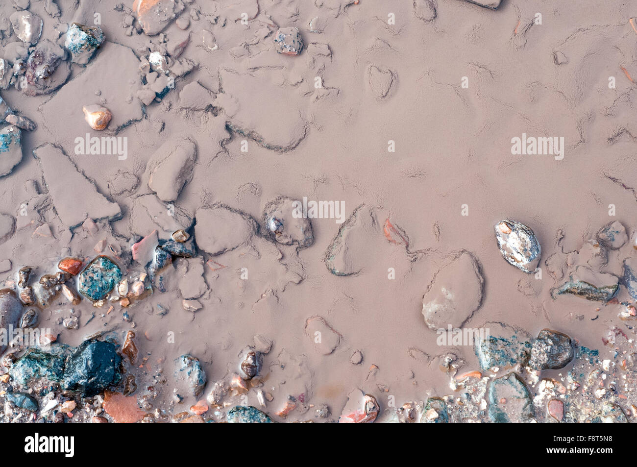 Abstract background showing stones in a muddy pool of water Stock Photo ...