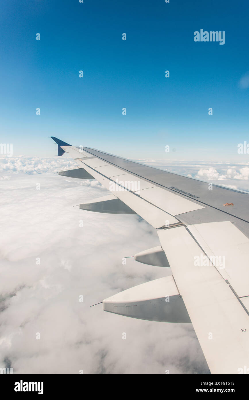 Airplane wing out of window Stock Photo - Alamy