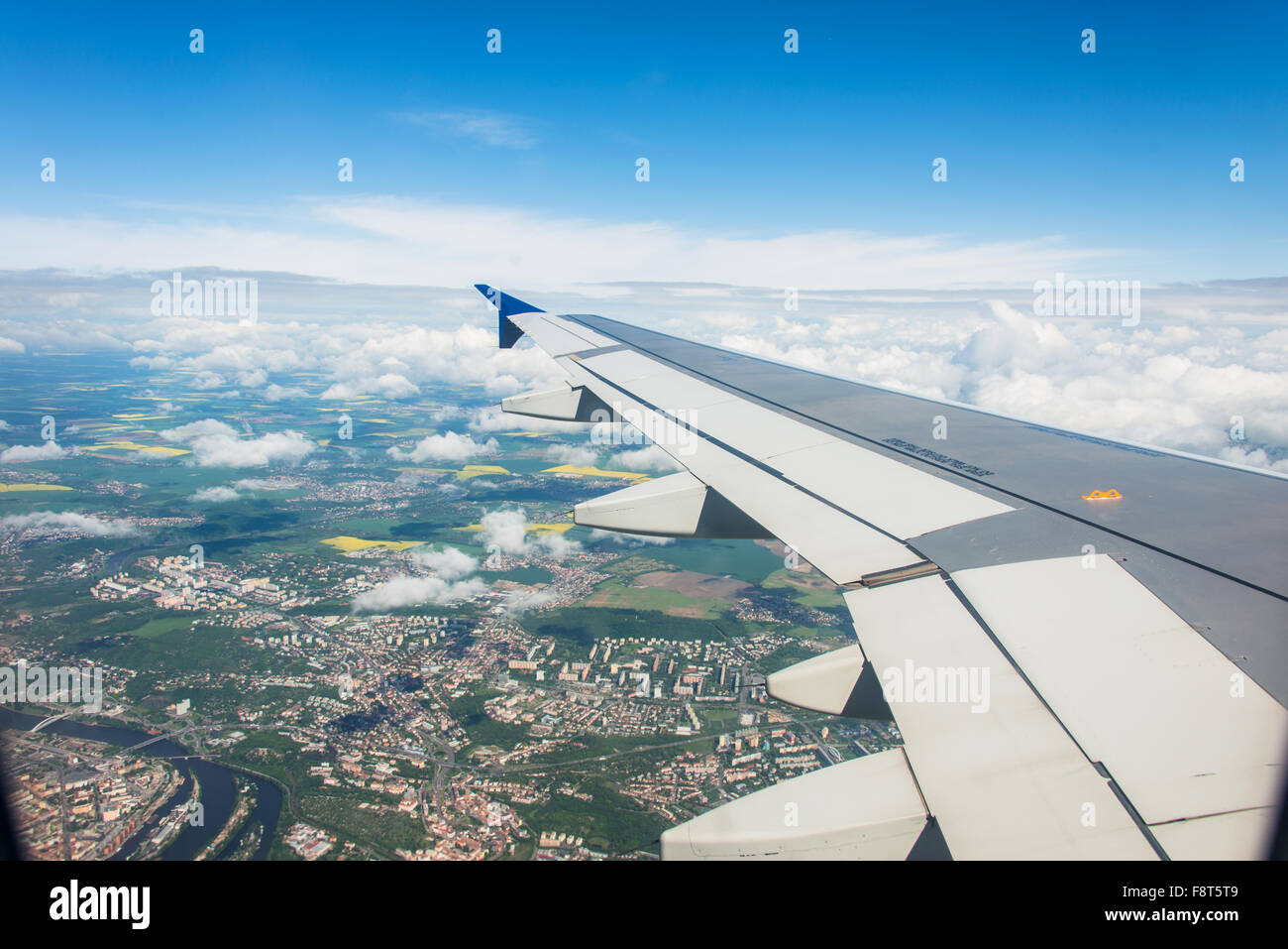 Airplane wing out of window Stock Photo - Alamy