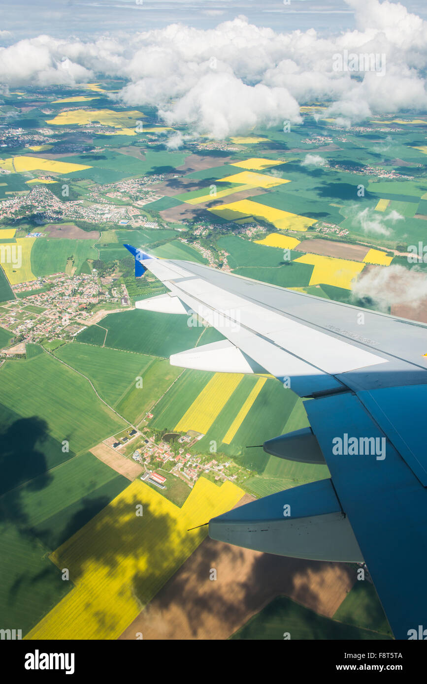Airplane wing out of window Stock Photo - Alamy