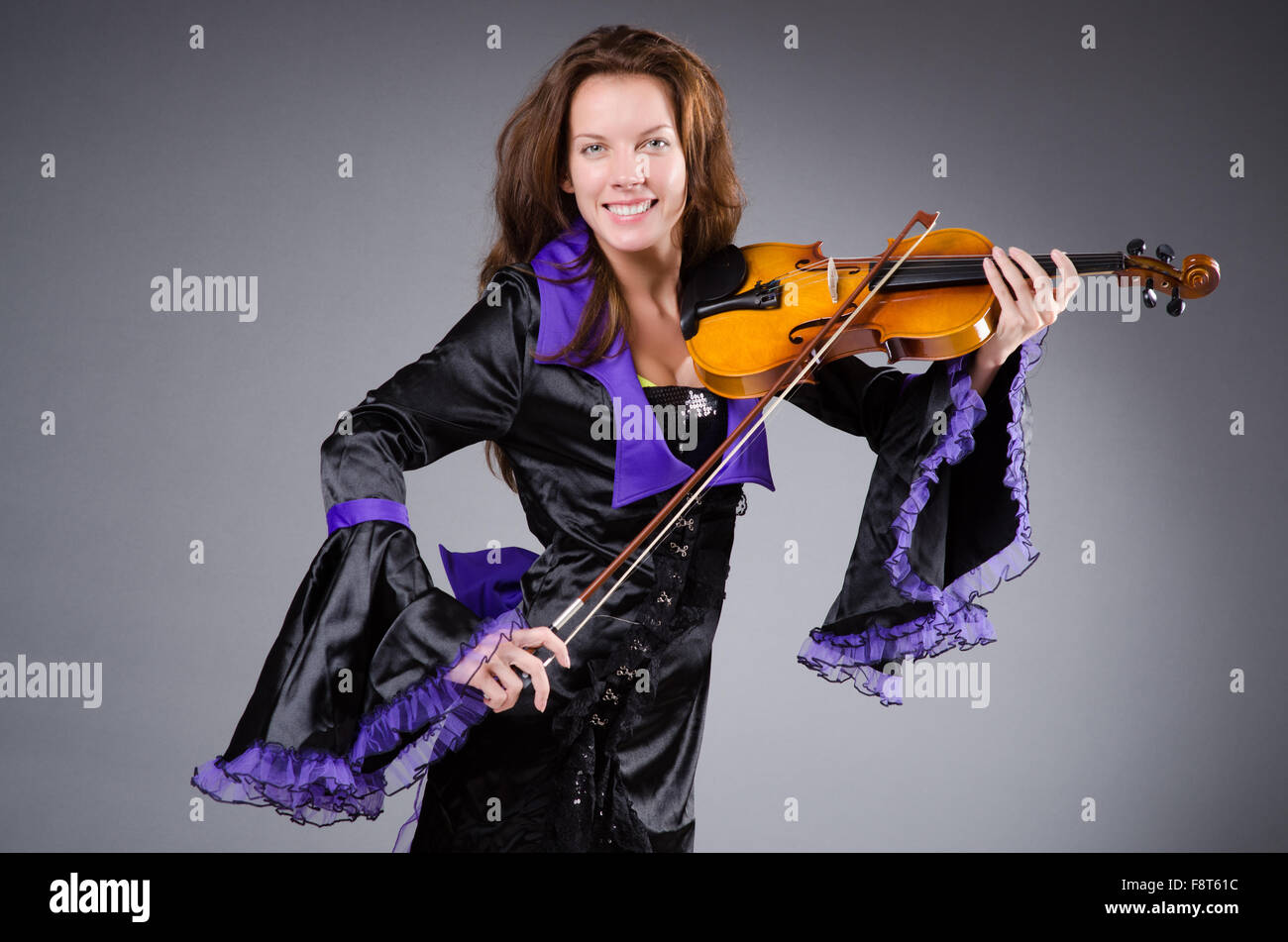 Woman artist with violin in music concept Stock Photo - Alamy
