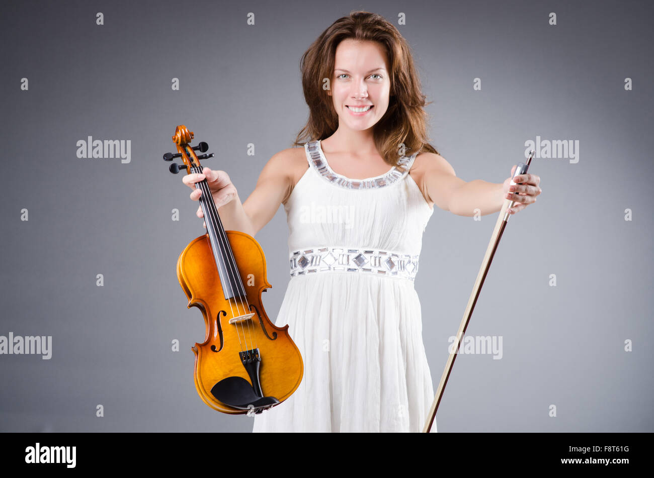 Woman artist with violin in music concept Stock Photo - Alamy