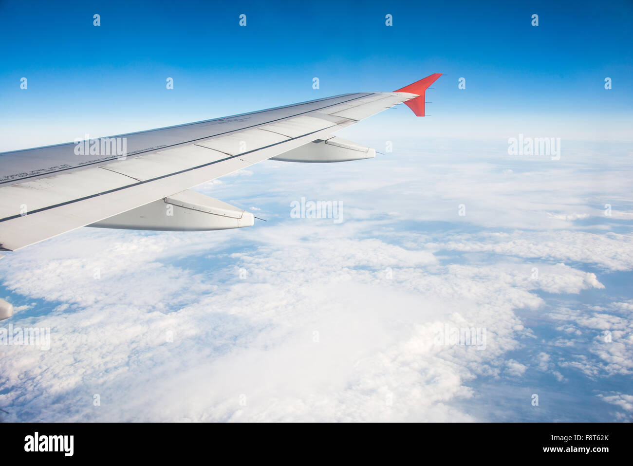 Airplane wing out of window Stock Photo - Alamy