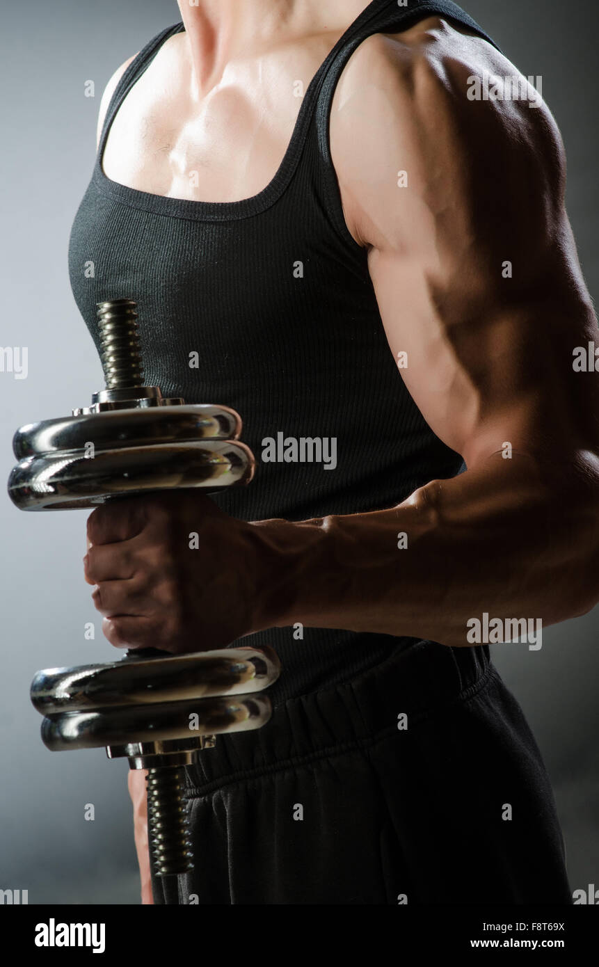 Muscular ripped bodybuilder with dumbbells Stock Photo - Alamy