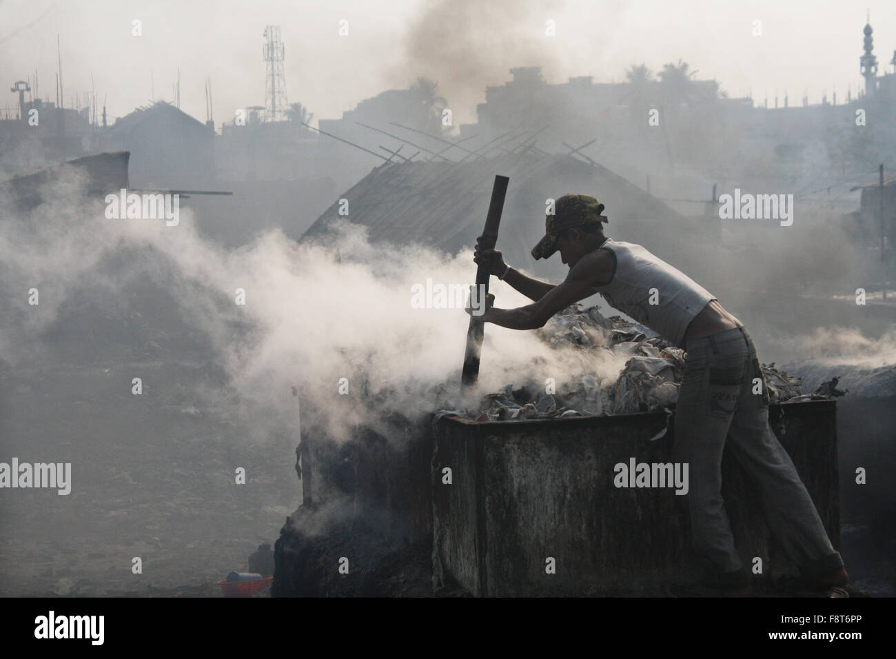 A Bangladeshi day labor works in the polluted environment at Hazaribagh ...