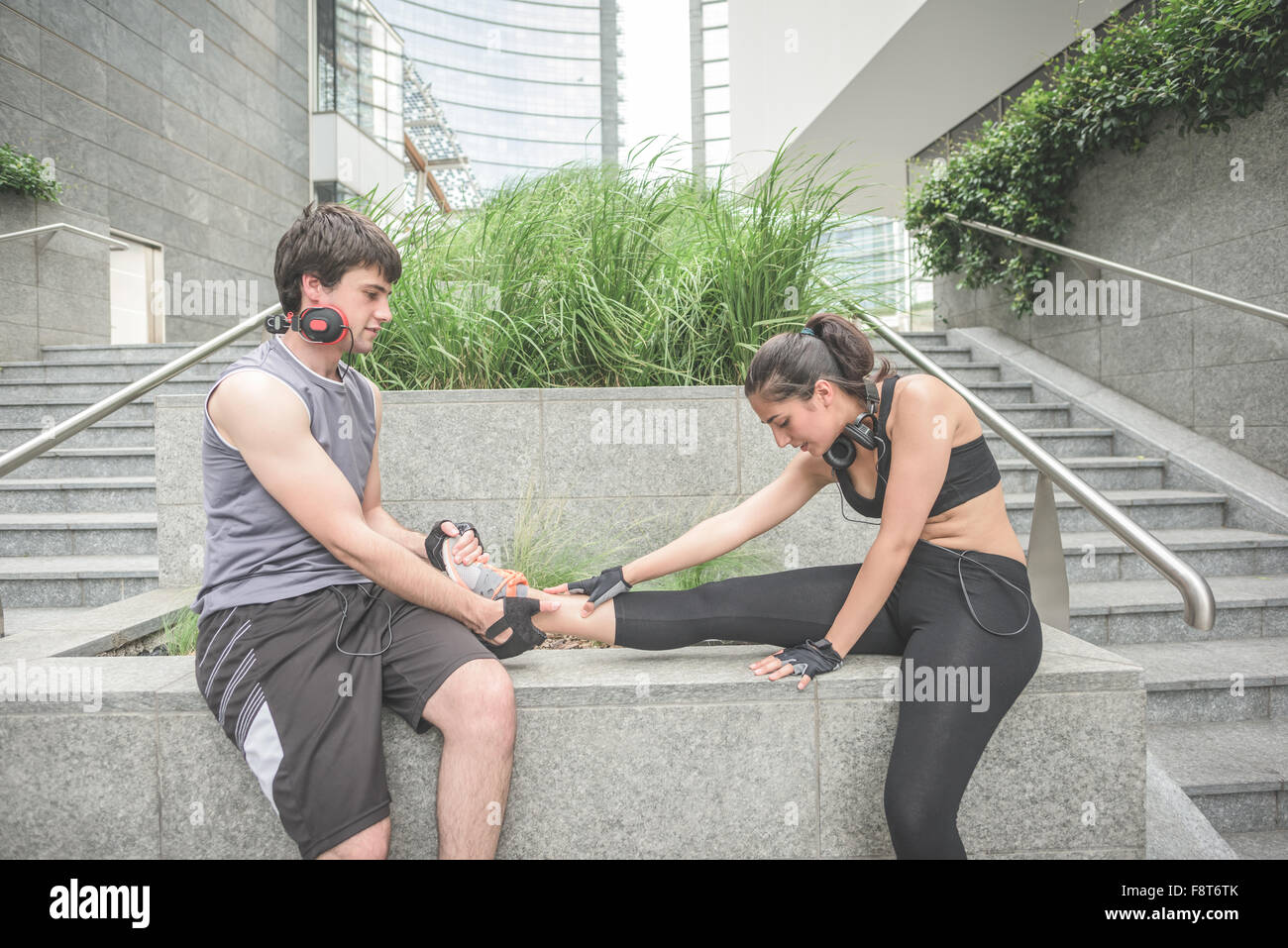 Helping each other stretch hi-res stock photography and images - Alamy