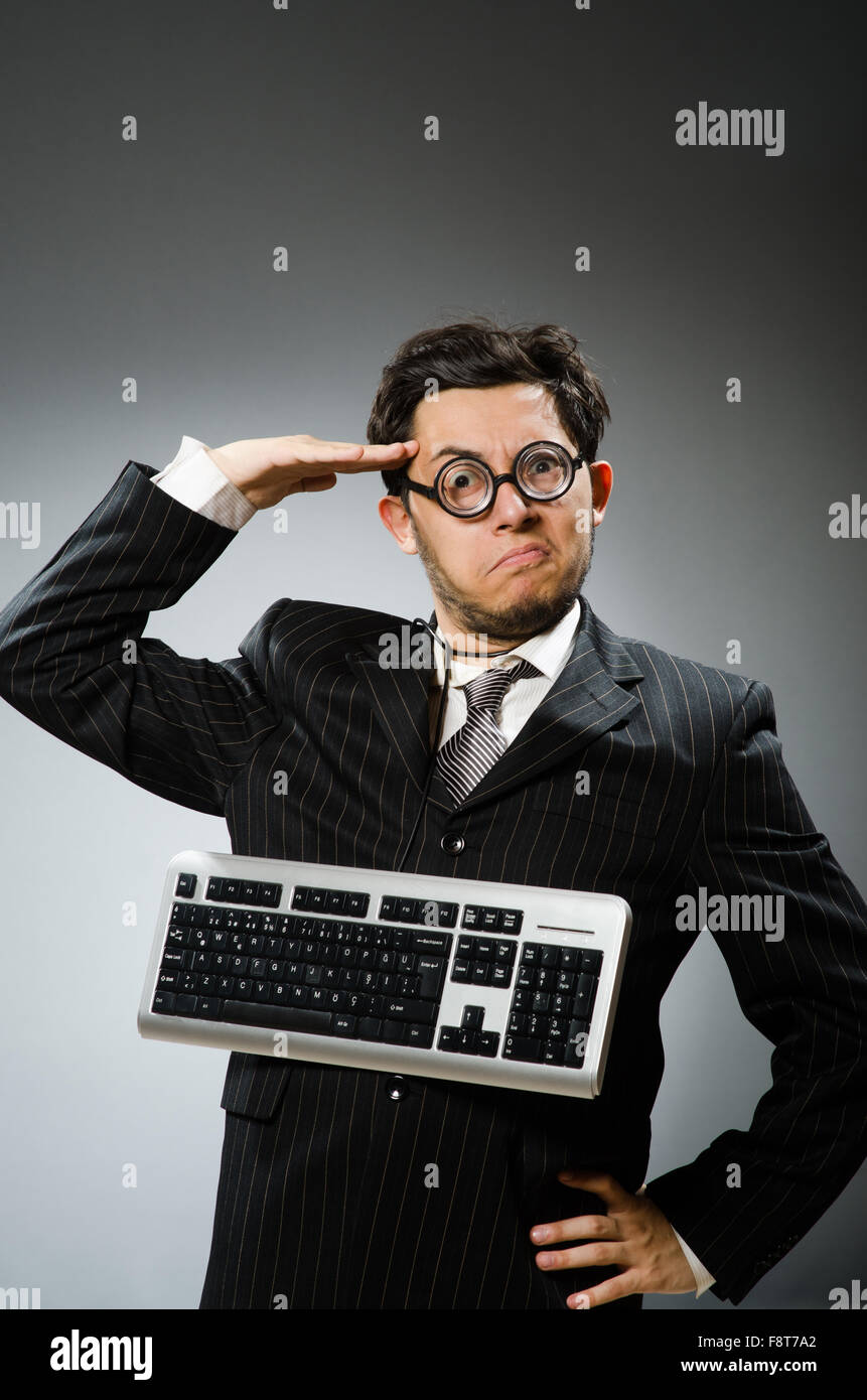 Comouter geek with computer keyboard Stock Photo - Alamy