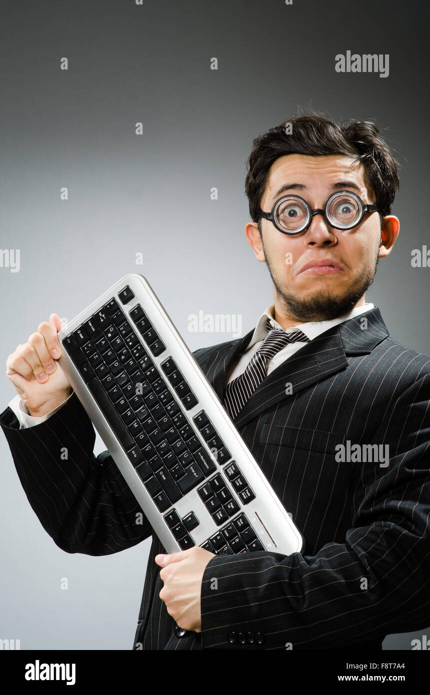 Comouter geek with computer keyboard Stock Photo - Alamy