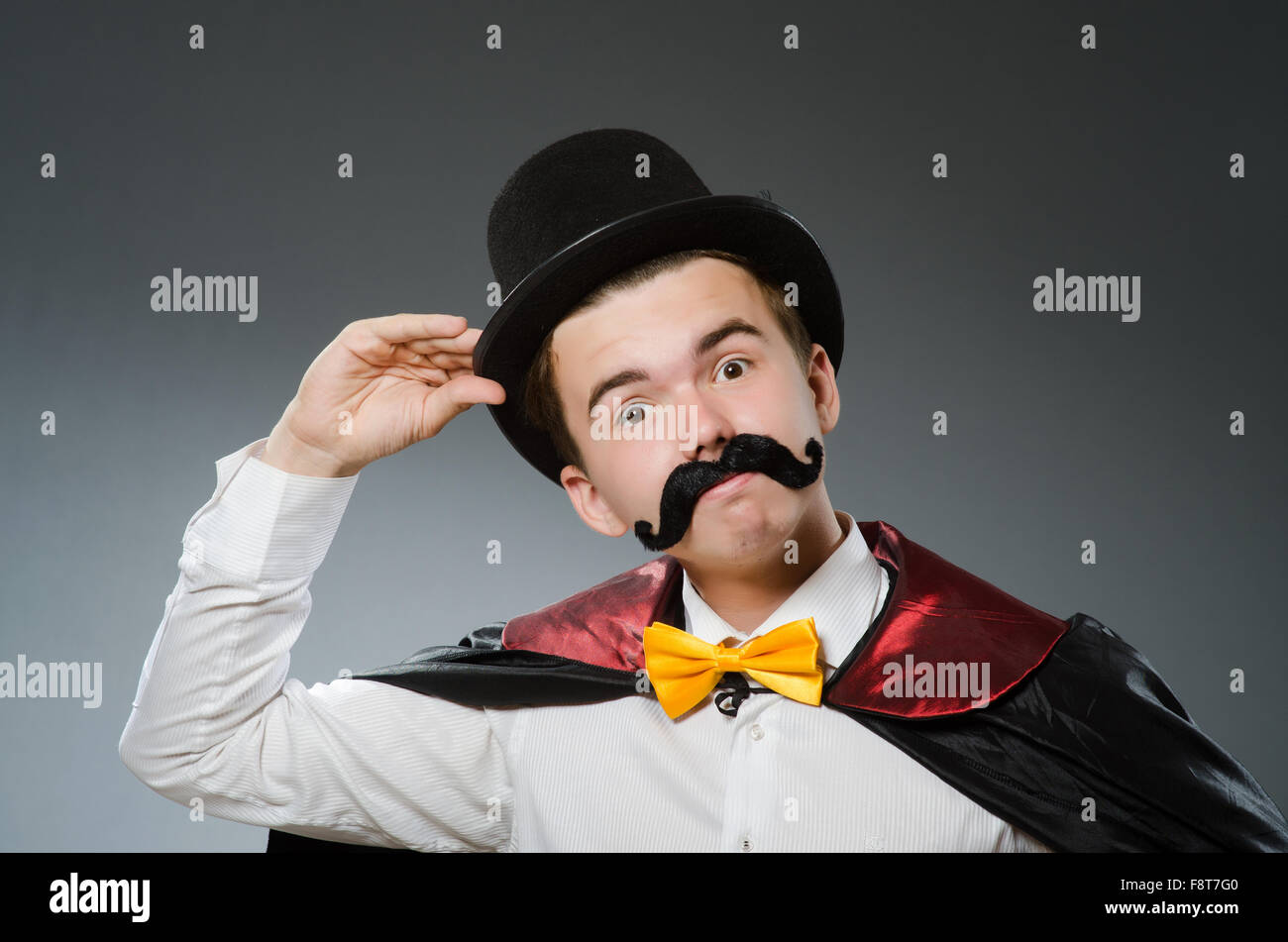 Funny magician with wand and hat Stock Photo - Alamy
