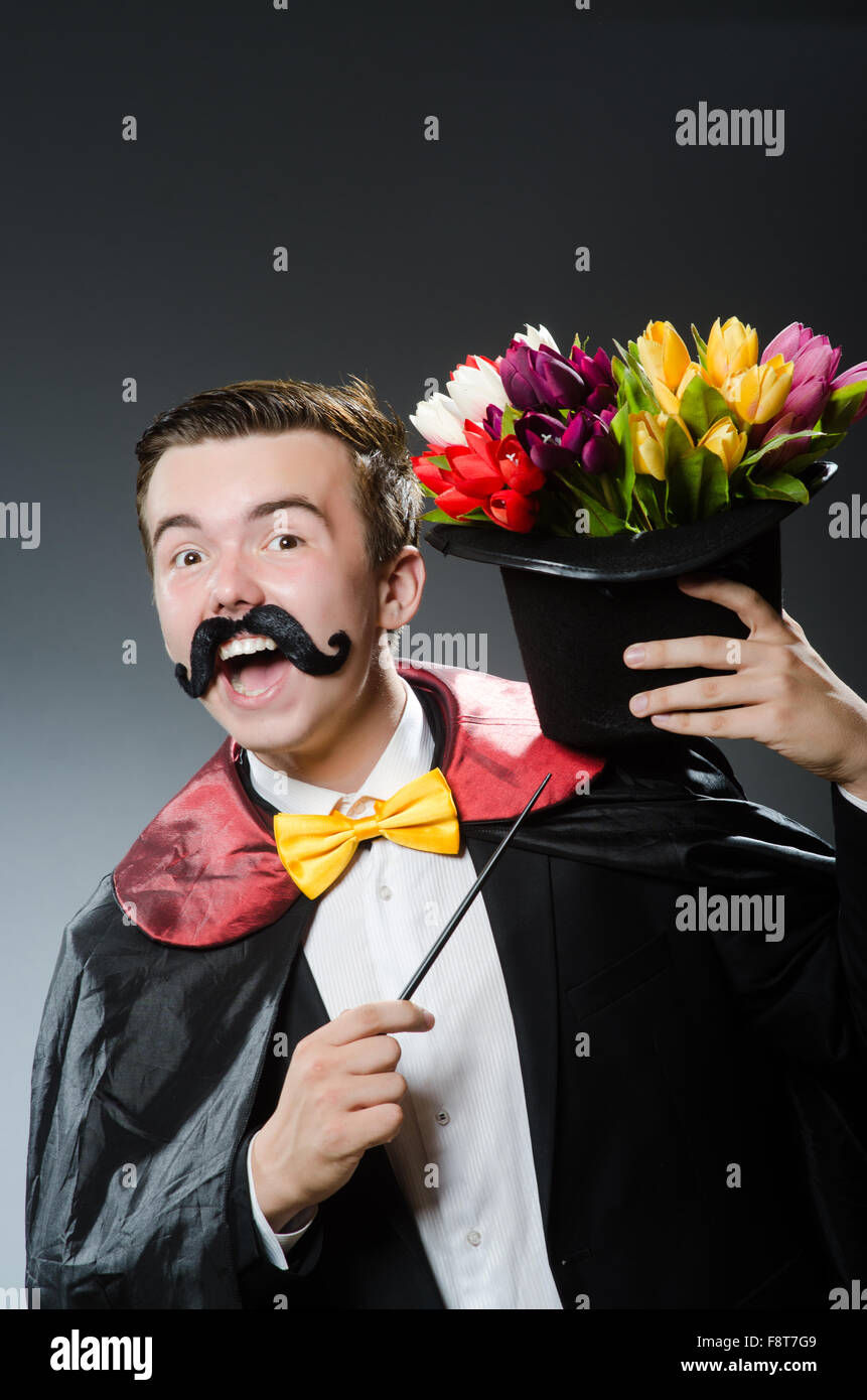 Funny magician with wand and hat Stock Photo - Alamy