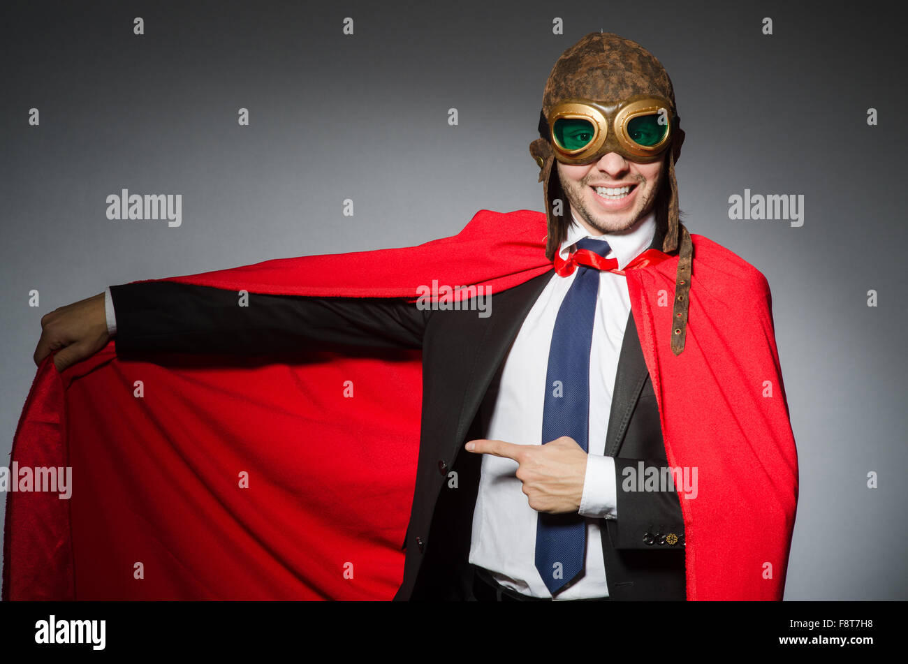 Superman concept with man in red cover Stock Photo - Alamy