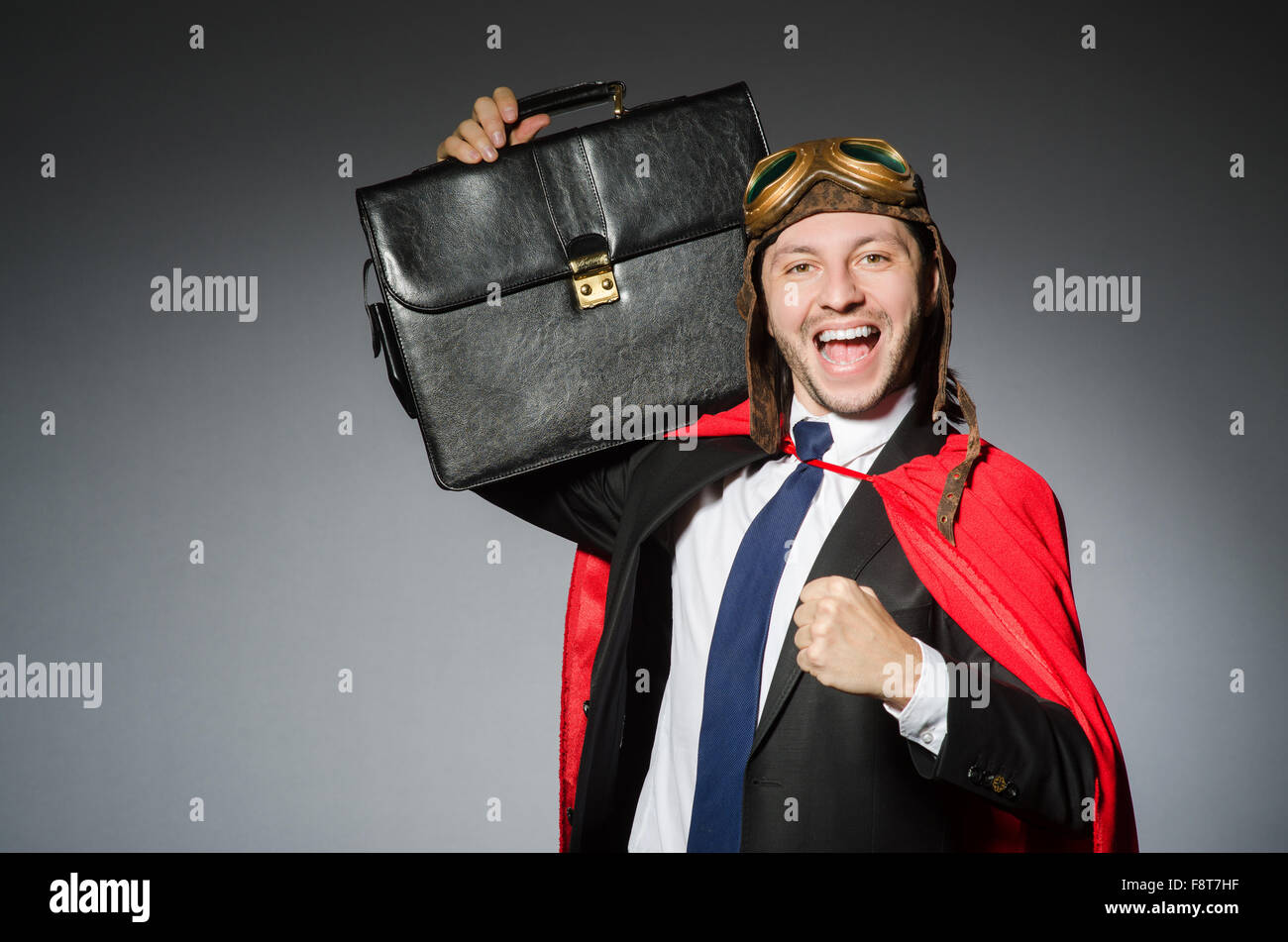 Superman concept with man in red cover Stock Photo - Alamy