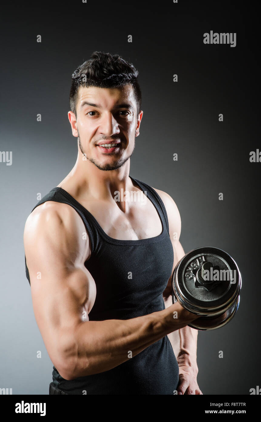 Muscular ripped bodybuilder with dumbbells Stock Photo - Alamy