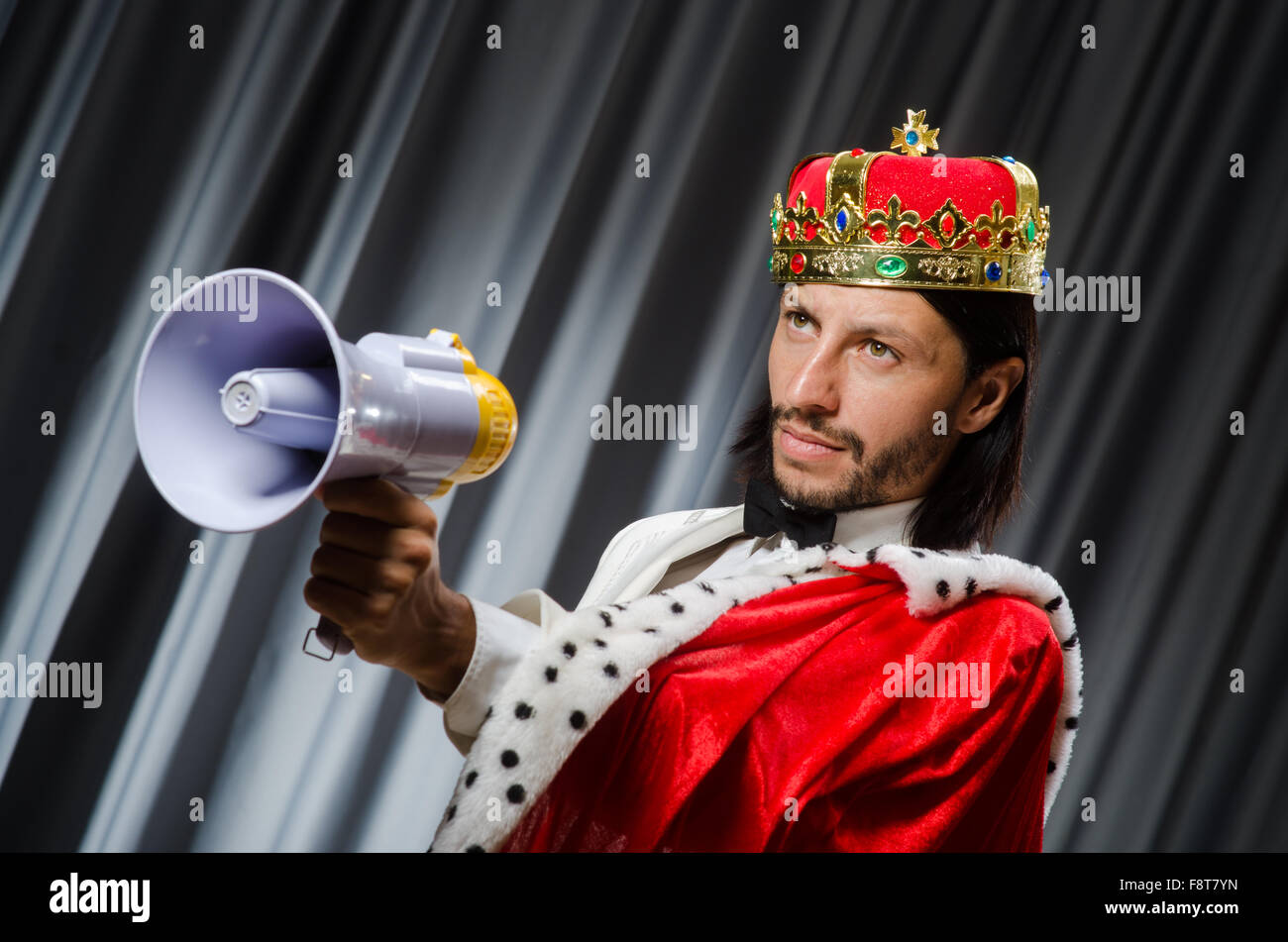 King with loudspeaker in funny concept Stock Photo - Alamy