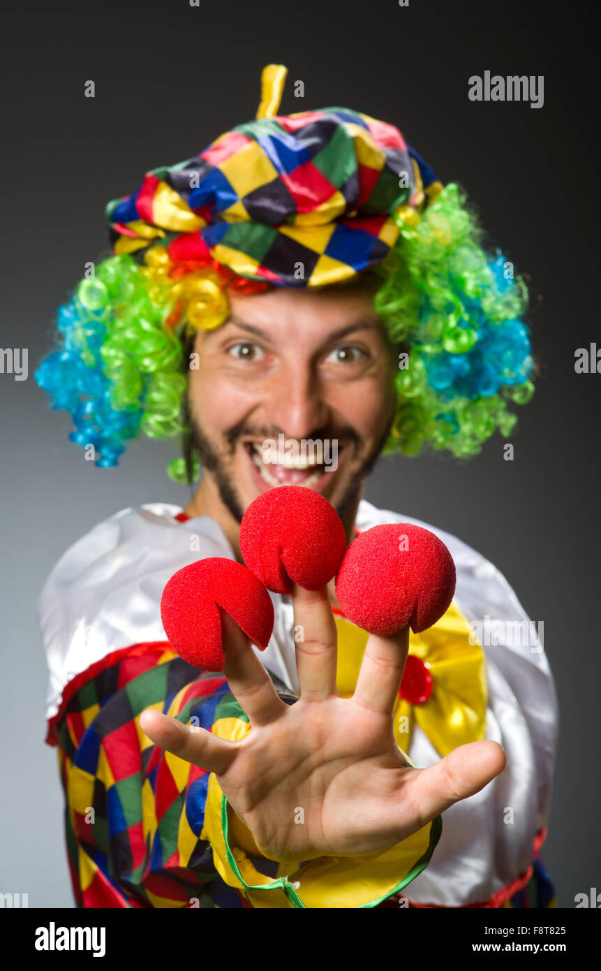 Funny clown in colourful costume Stock Photo - Alamy