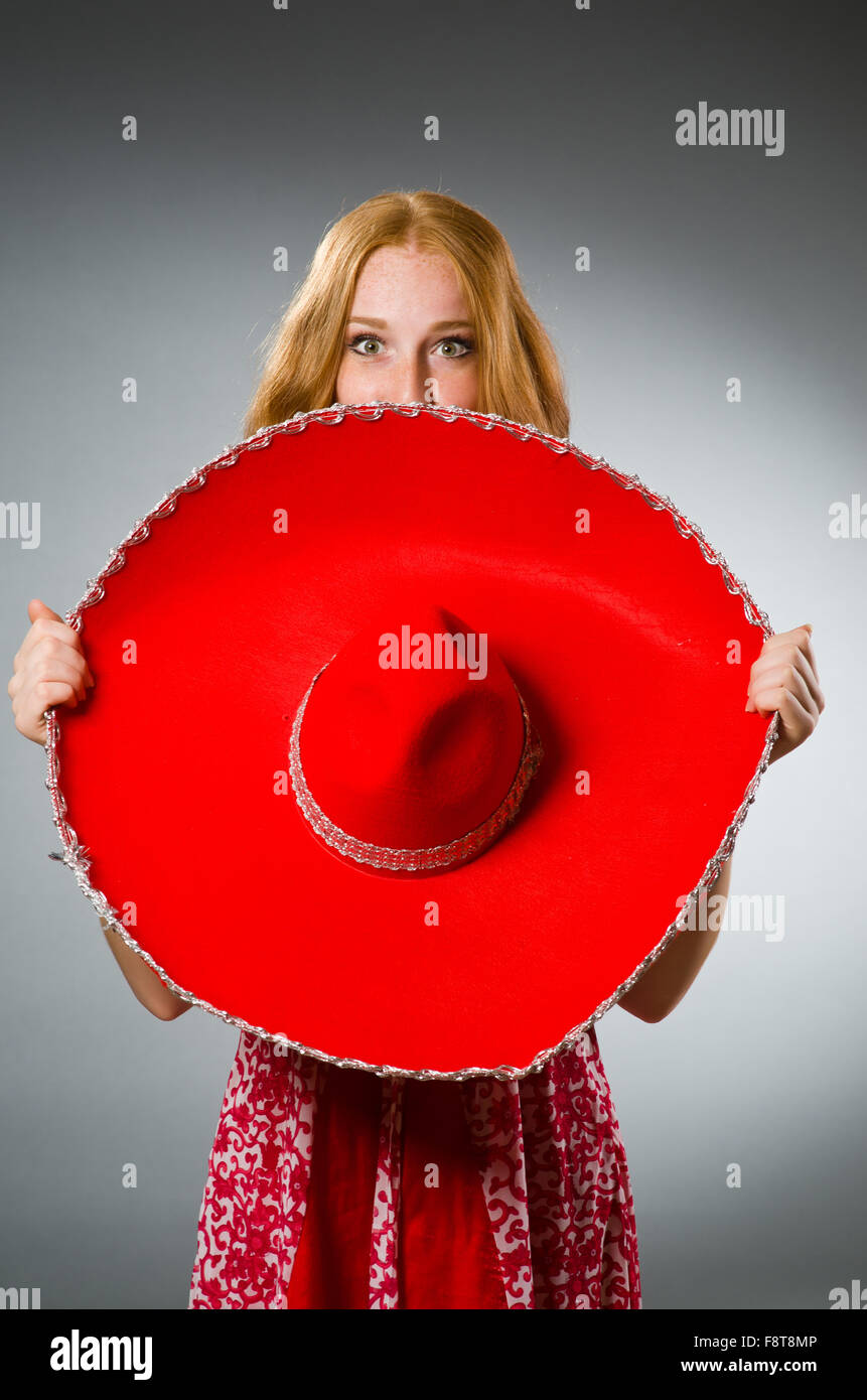 Mexican woman wearing red sombrero Stock Photo - Alamy