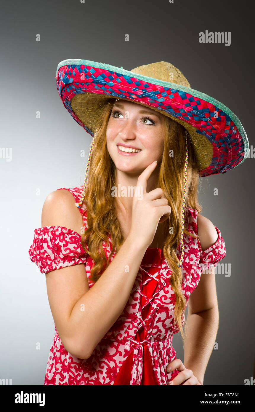Mexican woman wearing red sombrero Stock Photo - Alamy