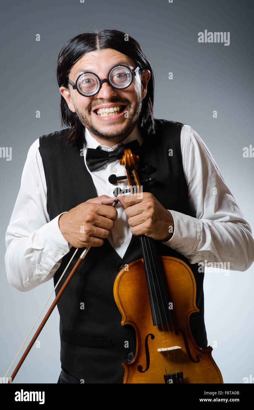 Funny fiddle violin player in musical concept Stock Photo - Alamy