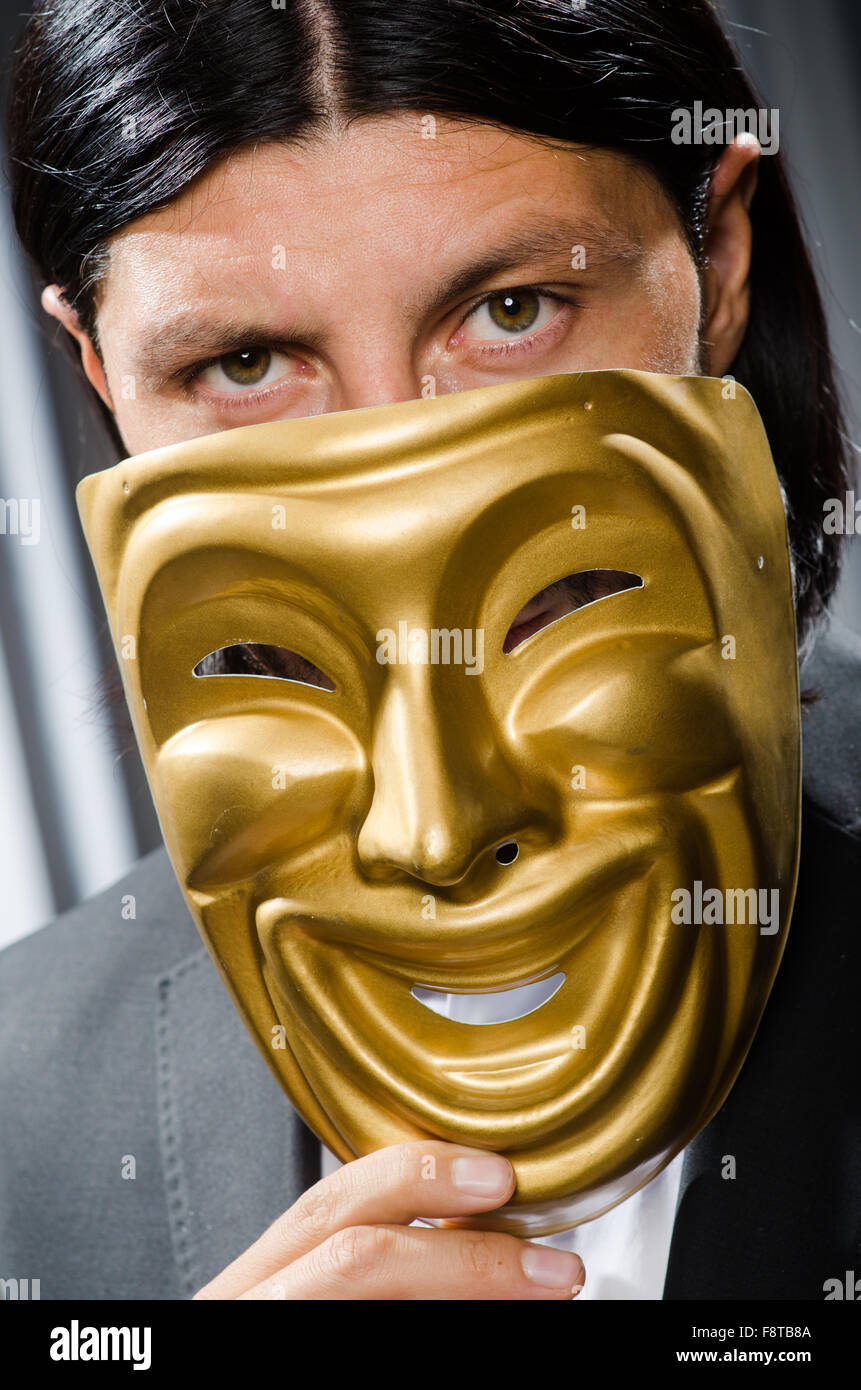 Funny concept with theatrical mask Stock Photo - Alamy