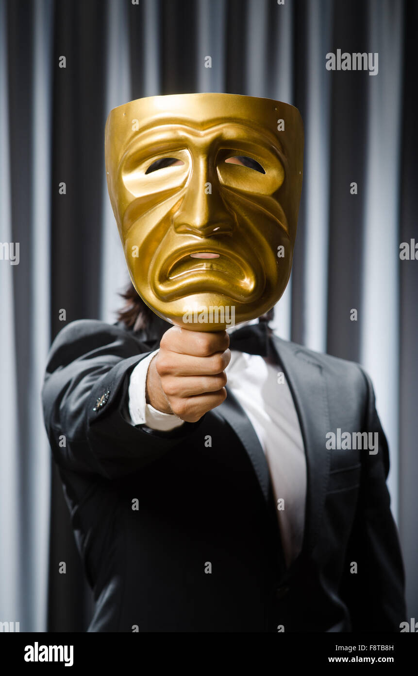 Funny concept with theatrical mask Stock Photo - Alamy