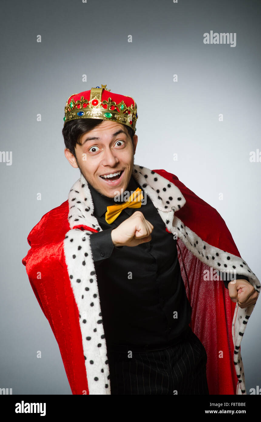 Concept with funny man wearing crown Stock Photo - Alamy