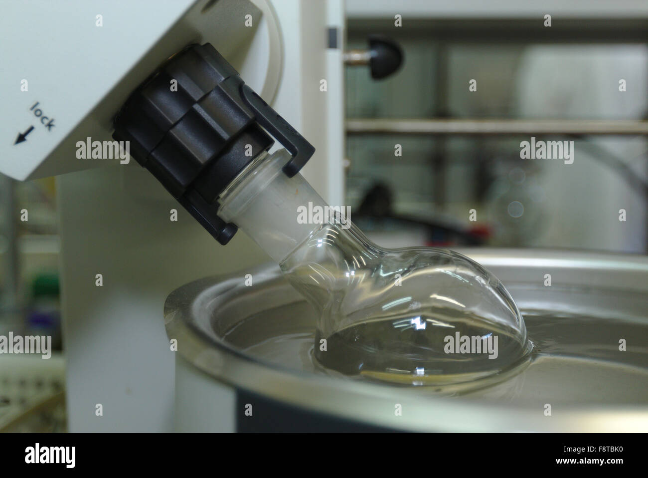 Flask attached to a rotary evaporator with a bath Stock Photo - Alamy