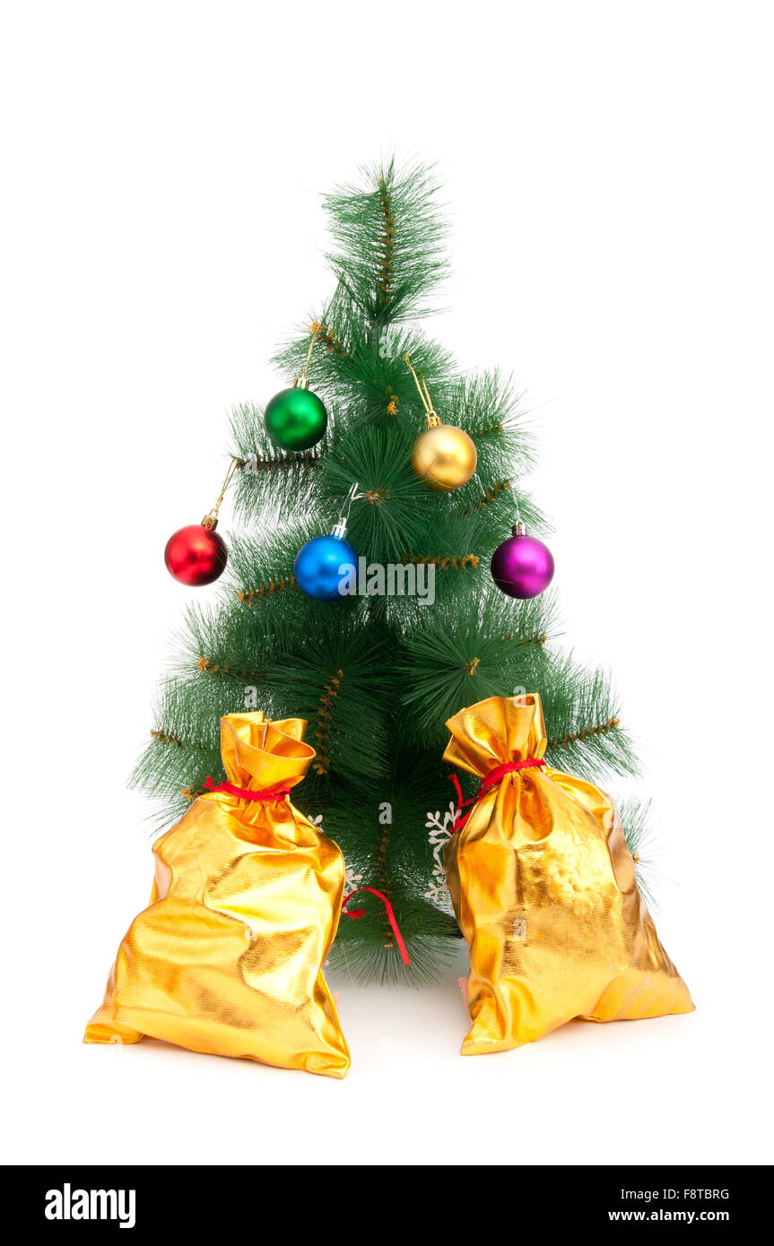 Christmas tree and golden sacks on white Stock Photo - Alamy
