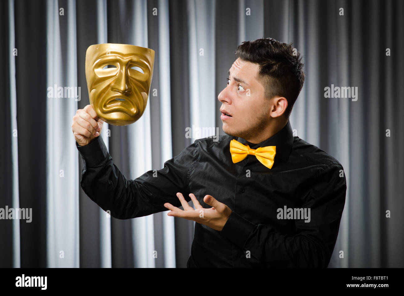 Funny concept with theatrical mask Stock Photo - Alamy