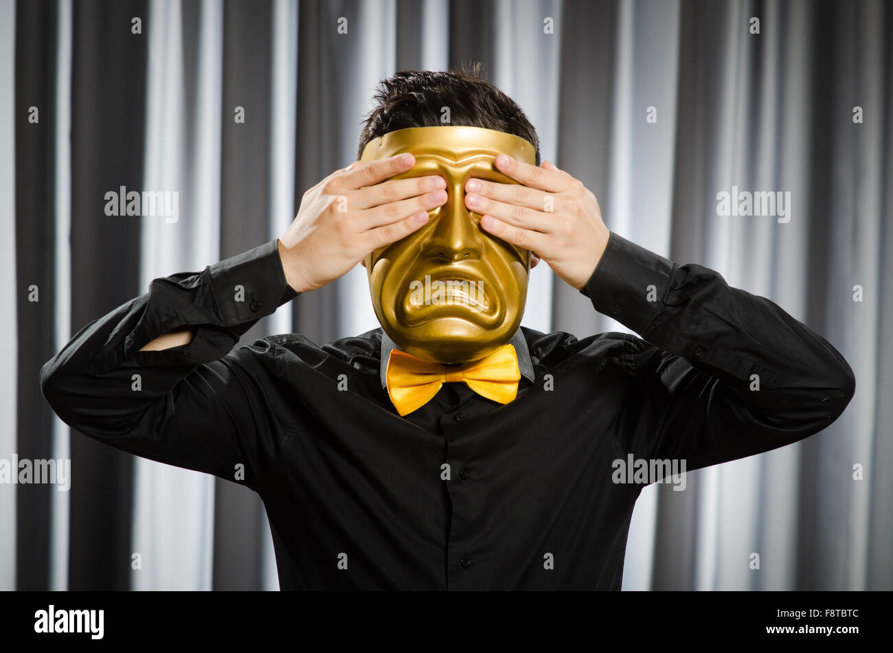 Funny concept with theatrical mask Stock Photo - Alamy