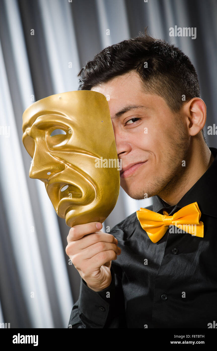 Funny concept with theatrical mask Stock Photo - Alamy