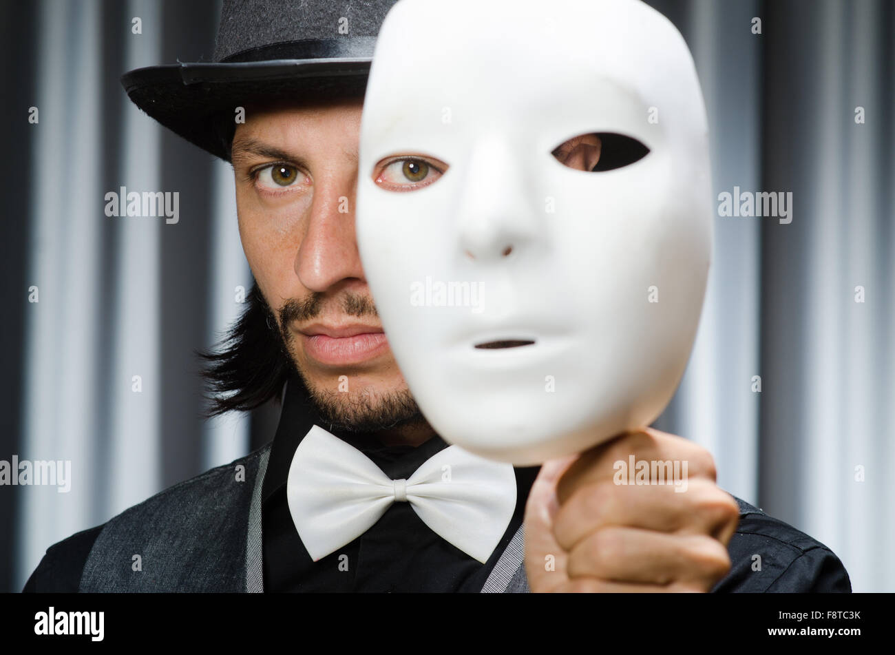 Funny concept with theatrical mask Stock Photo - Alamy